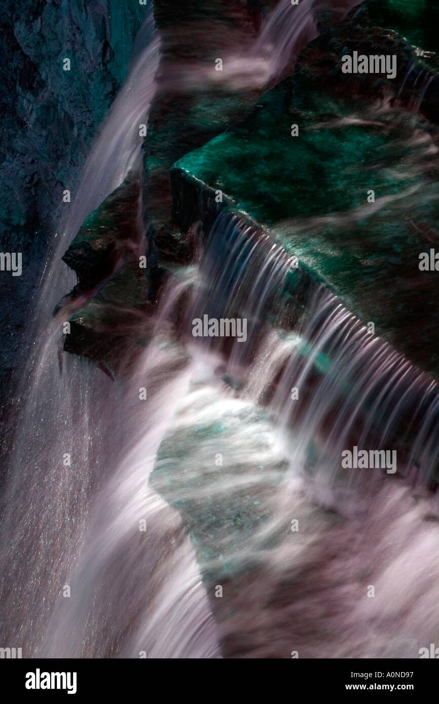 Motion shot of water running over small waterfall Stock Photo - Alamy