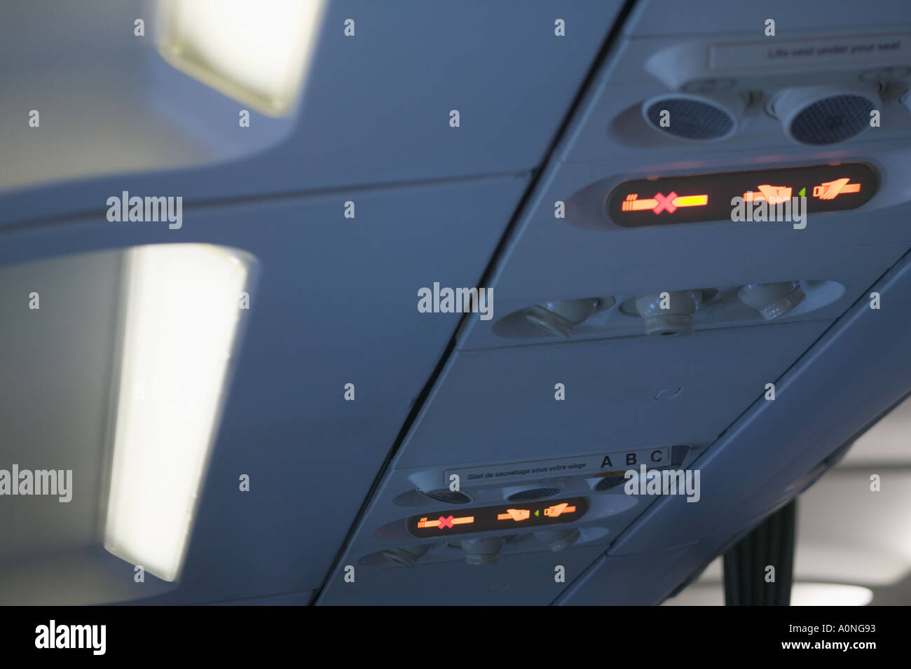 Jet airline overhead air and light control Stock Photo - Alamy