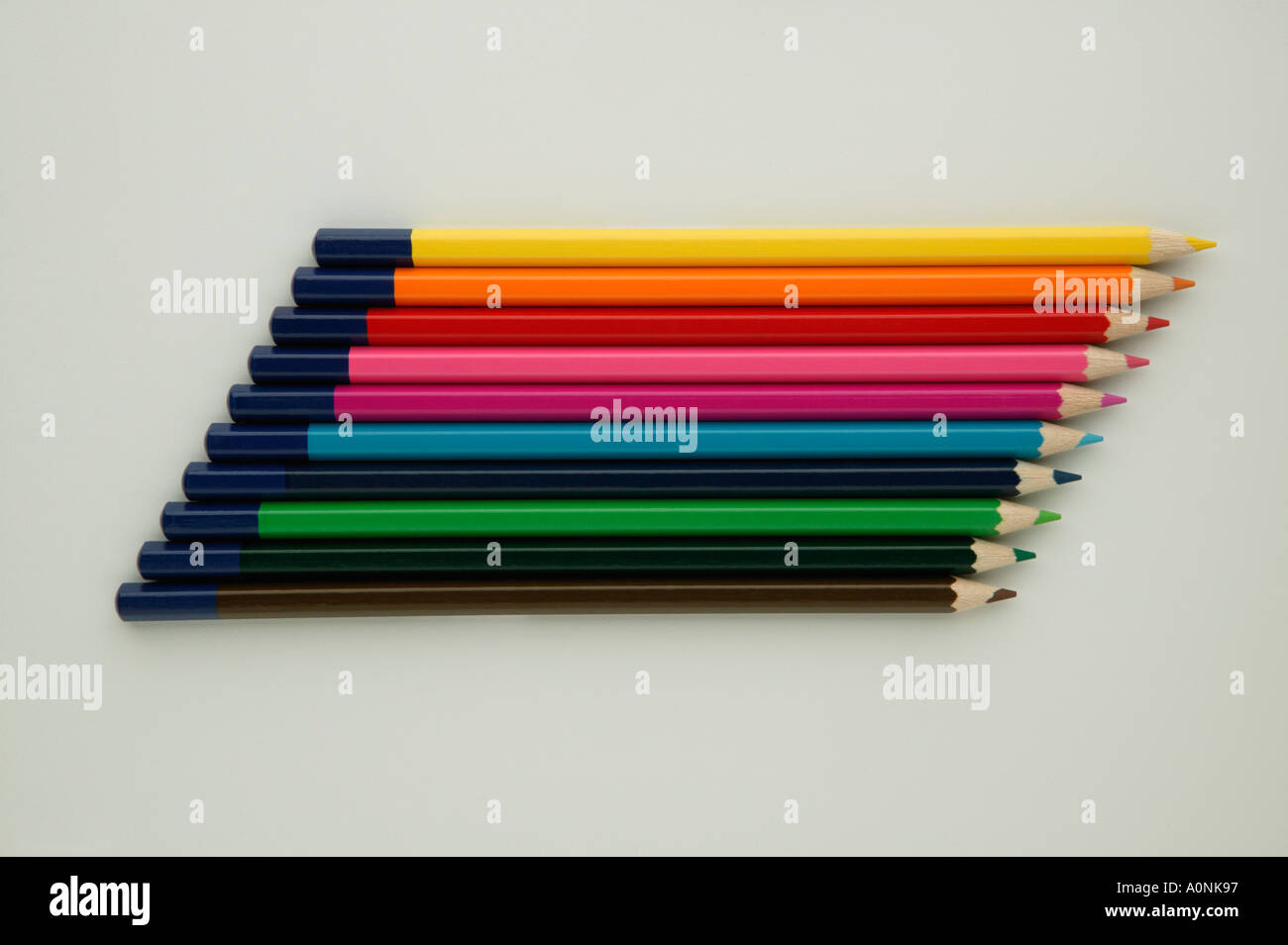A row of ten different coloured crayons on a white background Stock ...