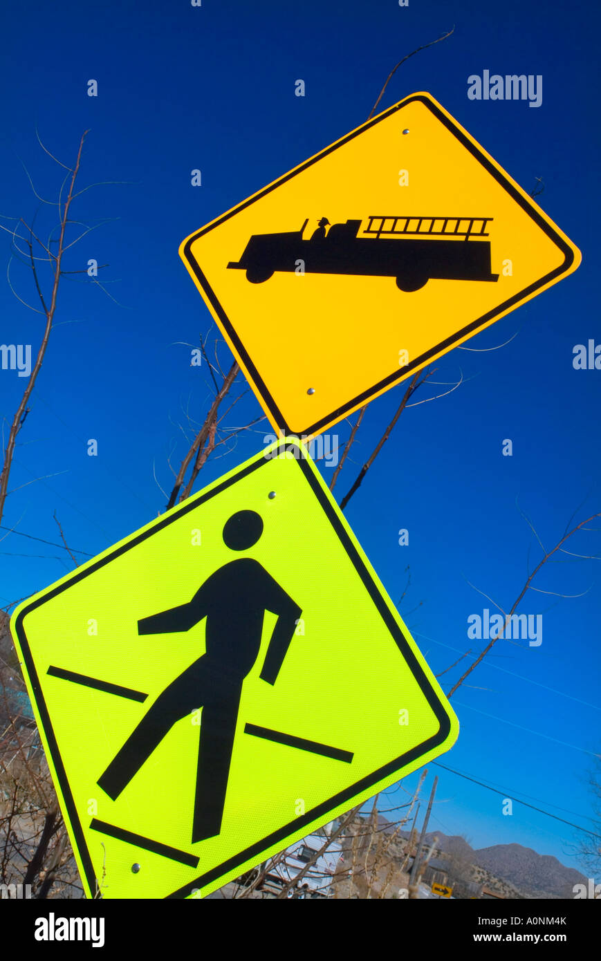 Two colorful metal traffic warning signs on one signpost Stock Photo ...