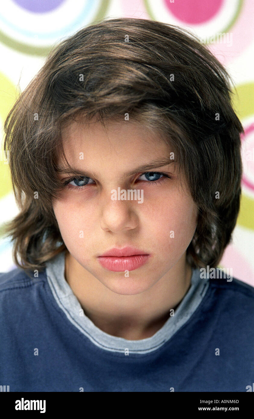 portrait of young boy looking angry Stock Photo - Alamy