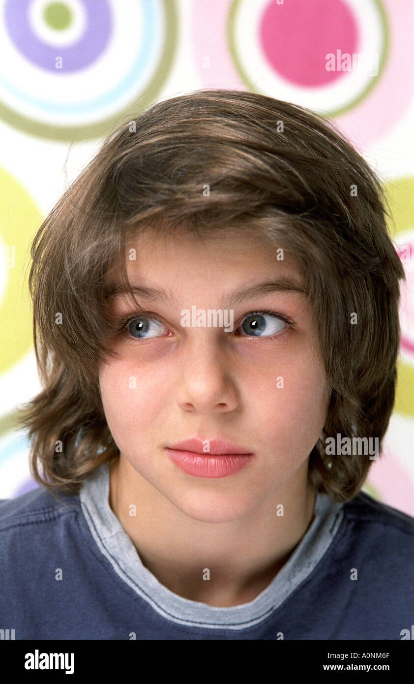 portrait of young boy looking sulky Stock Photo - Alamy