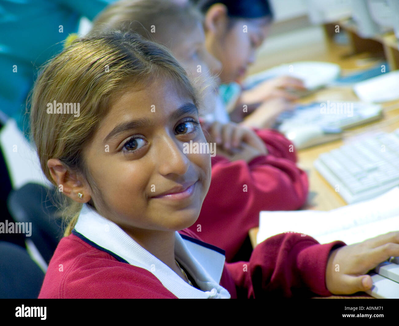 Confident junior schoolgirl pupil in school computer class Stock Photo ...