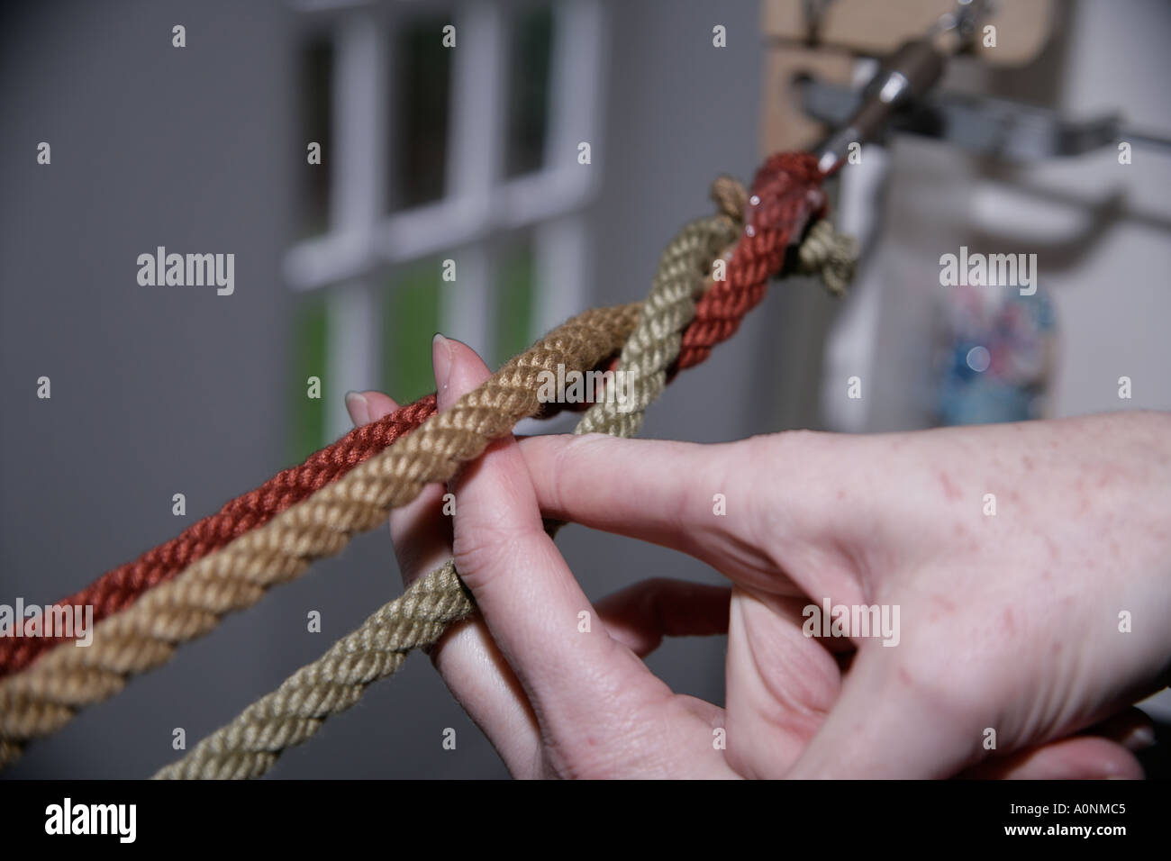Clare Hedges working with Tassels and Braids Stock Photo - Alamy