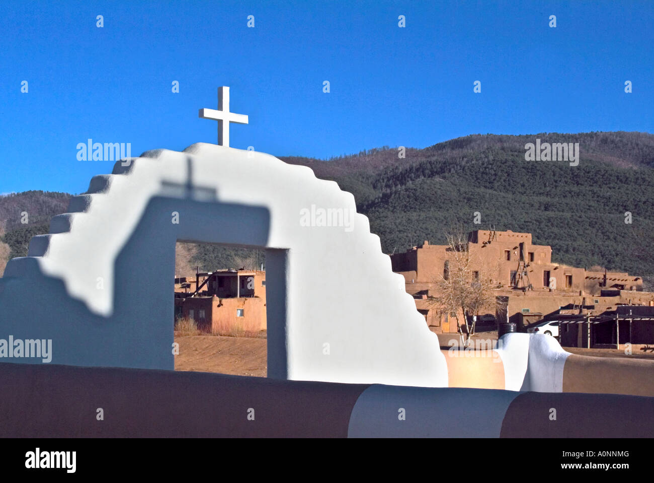 White cross on archway leading to church Stock Photo - Alamy
