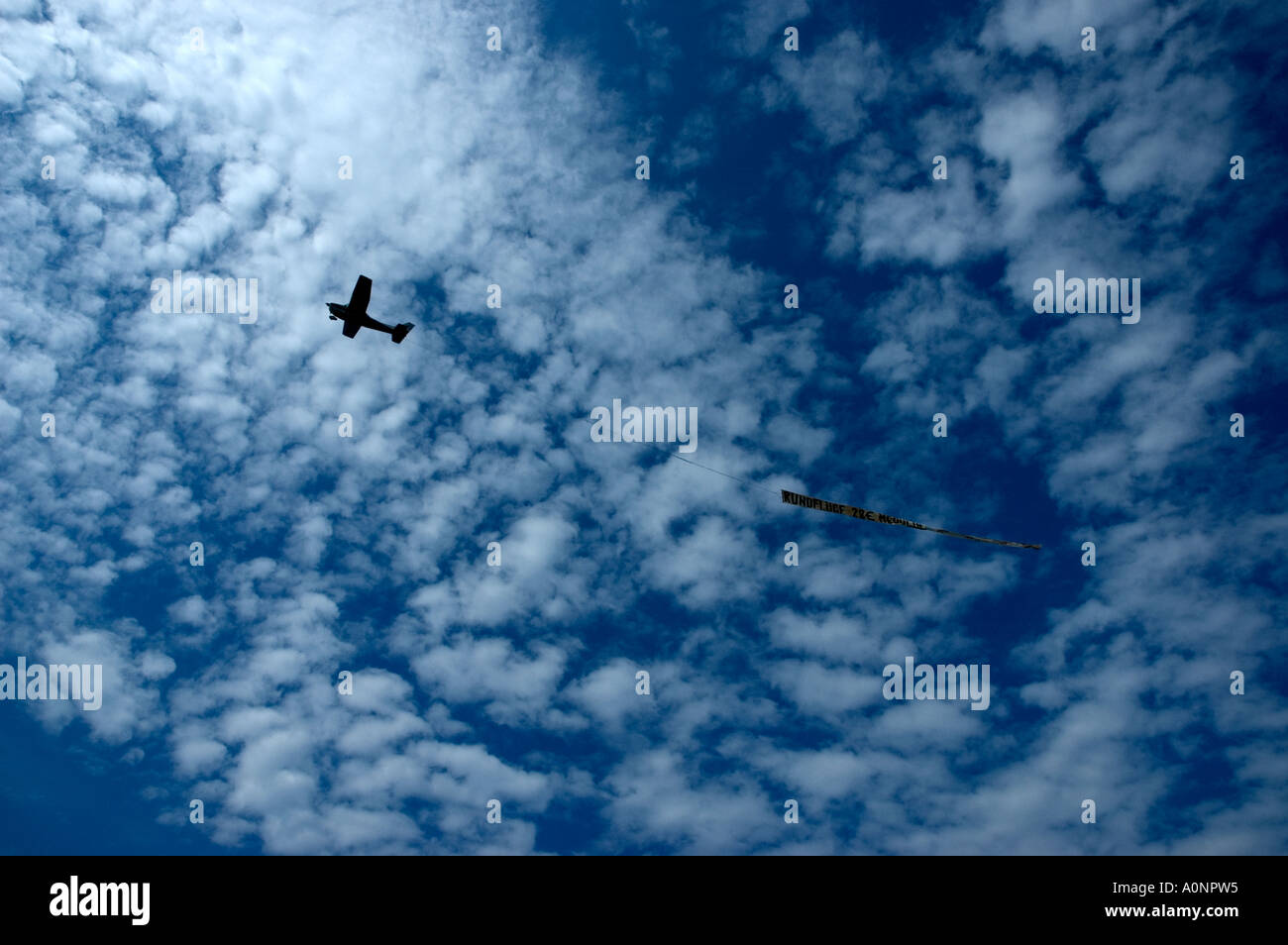 Airplane with banner advertisement - croatia Stock Photo - Alamy