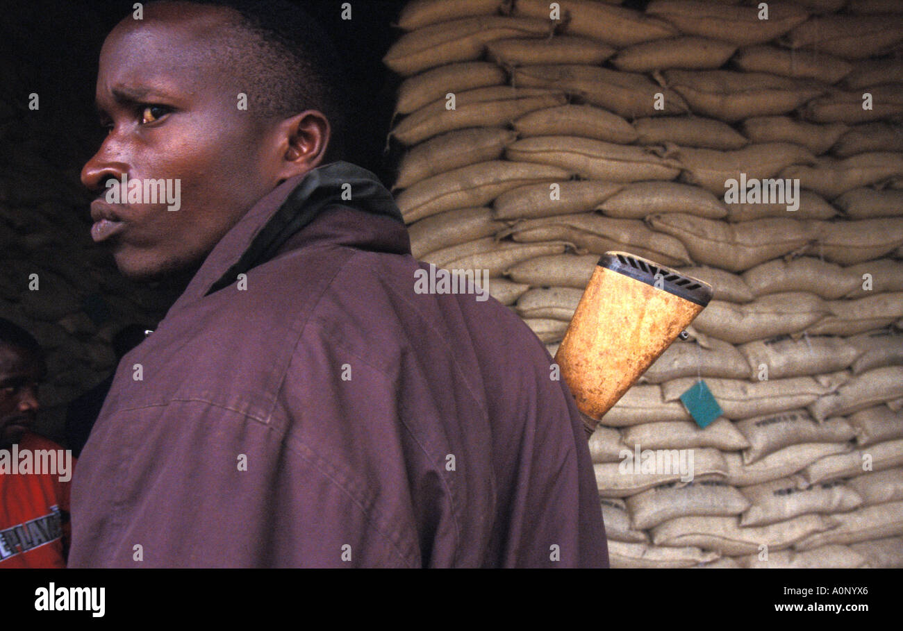 A guard protecting the coffee warehouse of Kemondo bay Stock Photo - Alamy