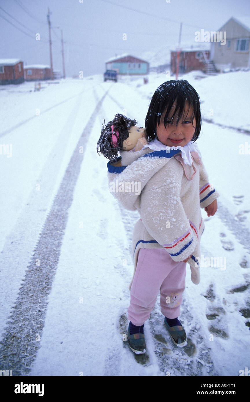Pond Inlet Inuit girl with her doll Stock Photo - Alamy