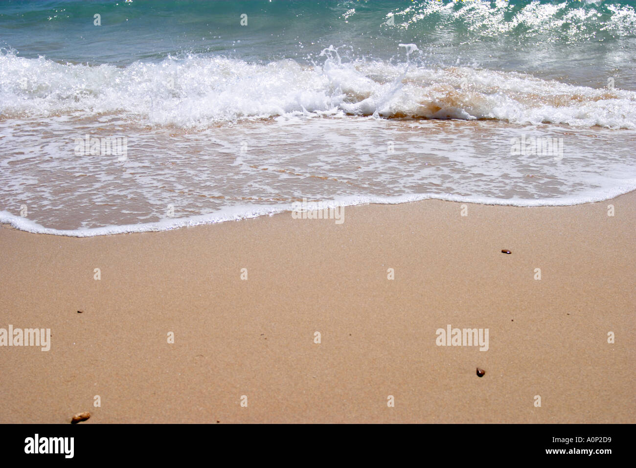 Waves breaking on the beach Stock Photo - Alamy