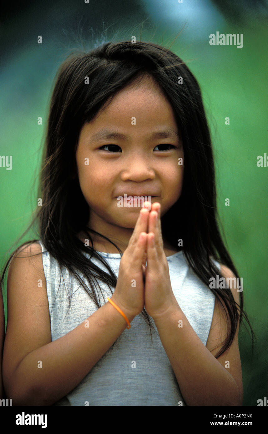 A girl making a wai sign Stock Photo - Alamy