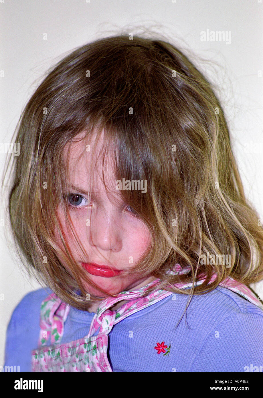 young child in a mood, sulking and looking grumpy and bedraggled Stock ...