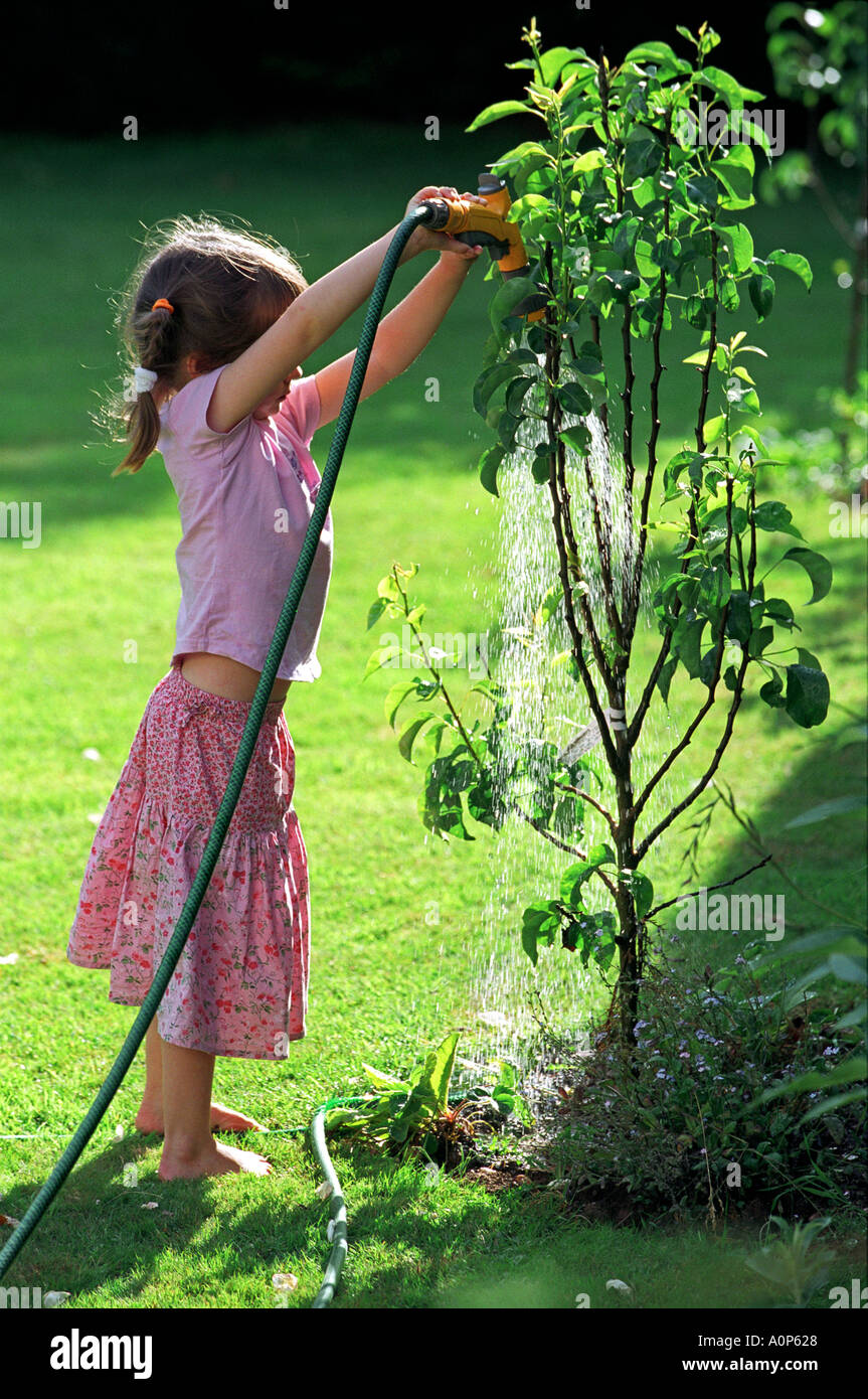 Child Water Hose Drink High Resolution Stock Photography and Images - Alamy