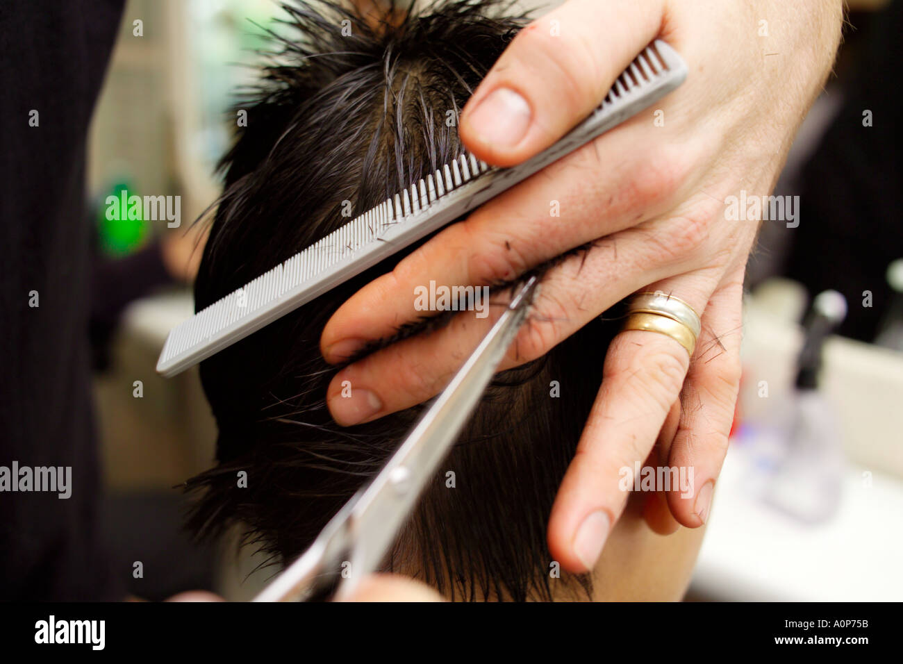 Teenage boy having his hair cut at a barbers in England Stock Photo - Alamy