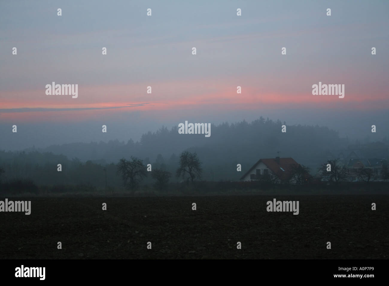 Sunset on a foggy day Stock Photo - Alamy