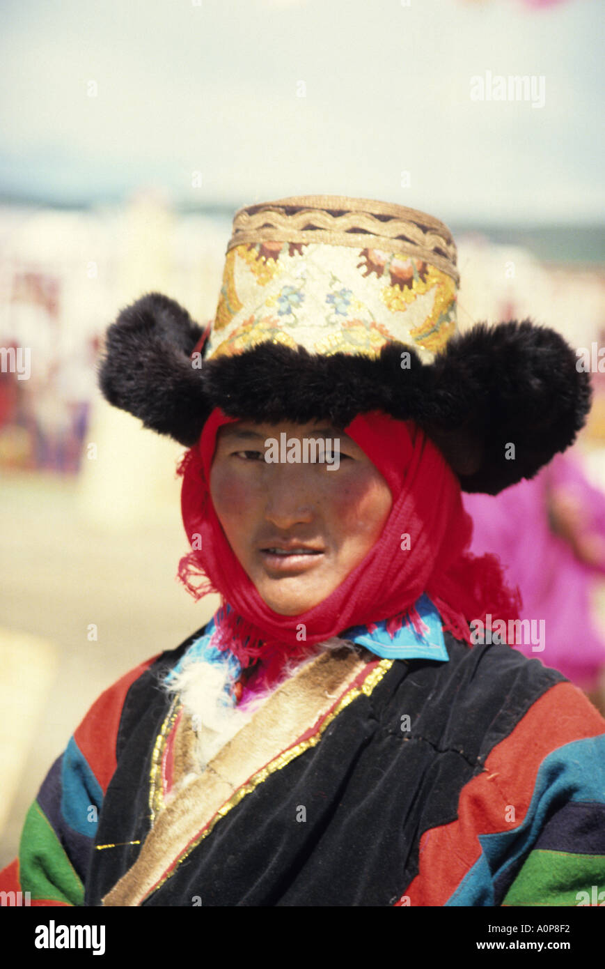 Nomadic woman in TIbet dressed for the Naqu annual horse fair.China ...