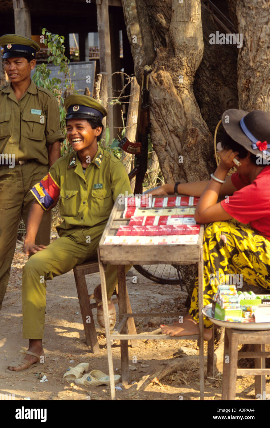 young Cambodian soldier buying cigarettes in Siem Reap market near ...
