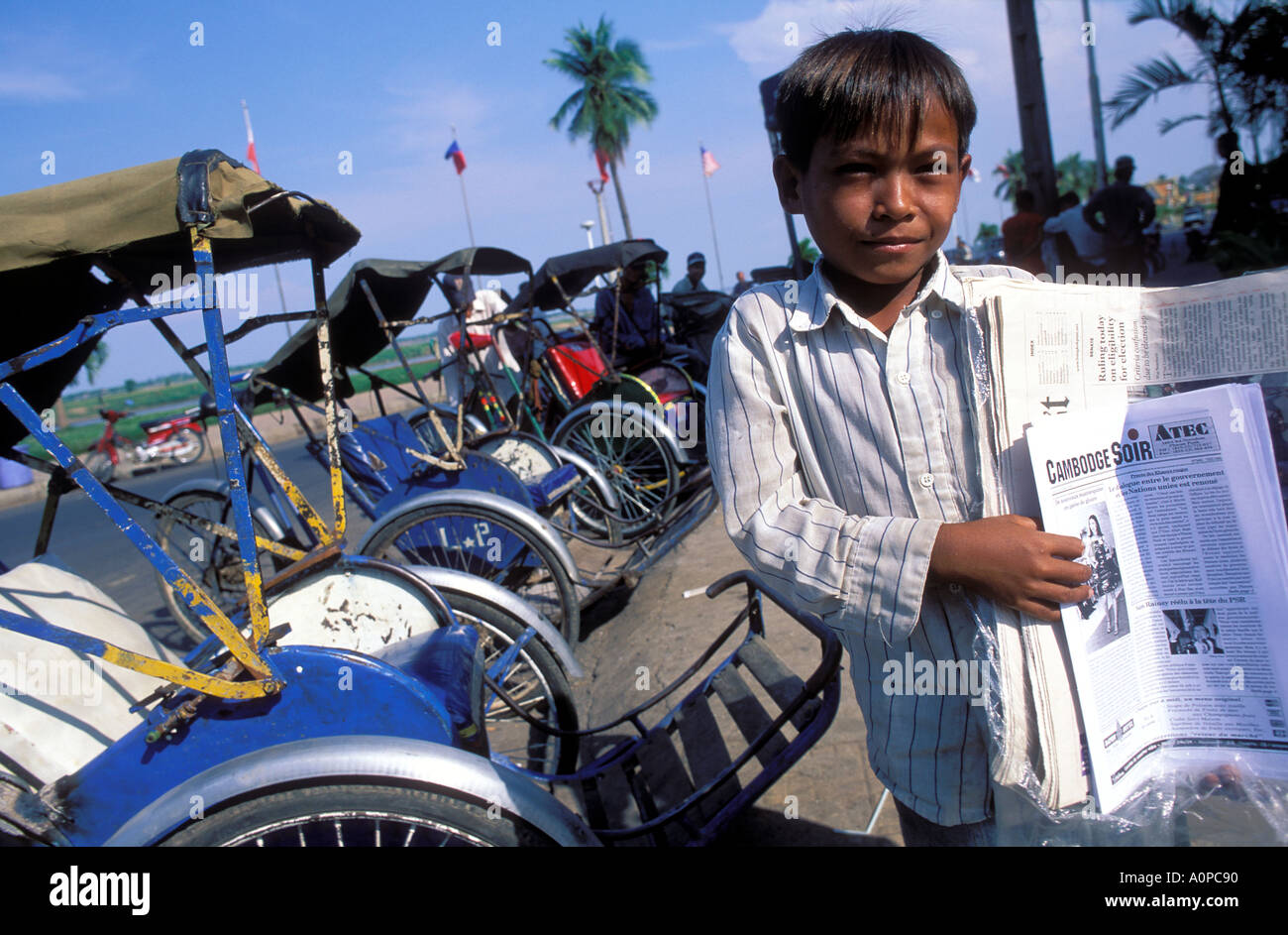 Young Khmer boy selling newspapers Phnom Penh Cambodia Stock Photo - Alamy