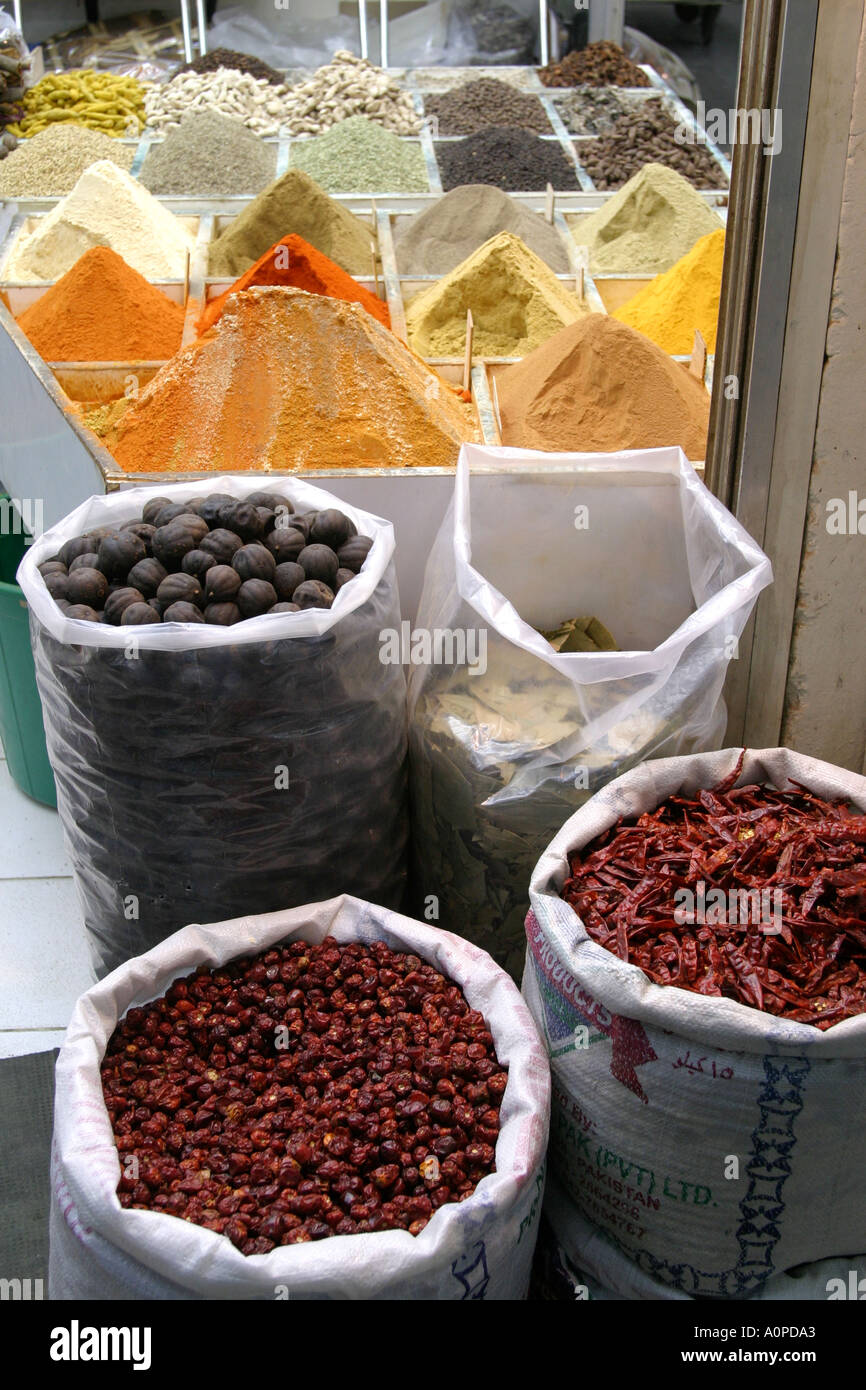Bags of different coloured spices in a Doha Souk Stock Photo - Alamy