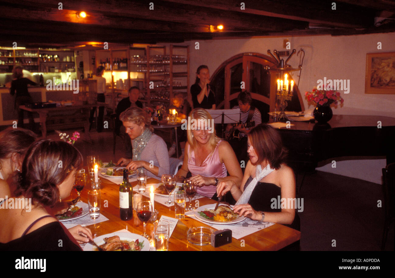 Denmark Copenhagen young women sitting at the Spiseloppen restaurant in ...