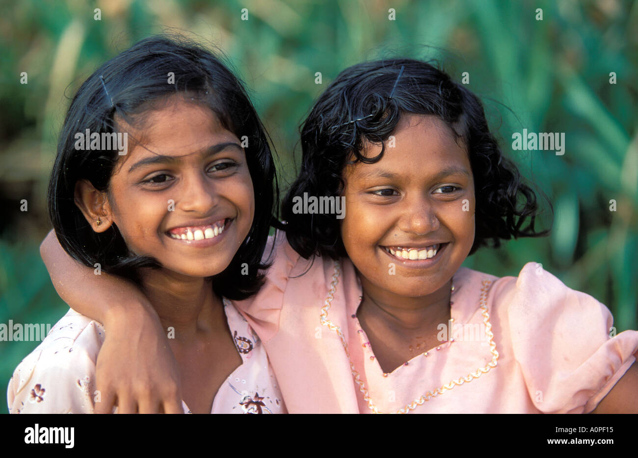 Two young girls smiling Sri Lanka Stock Photo - Alamy