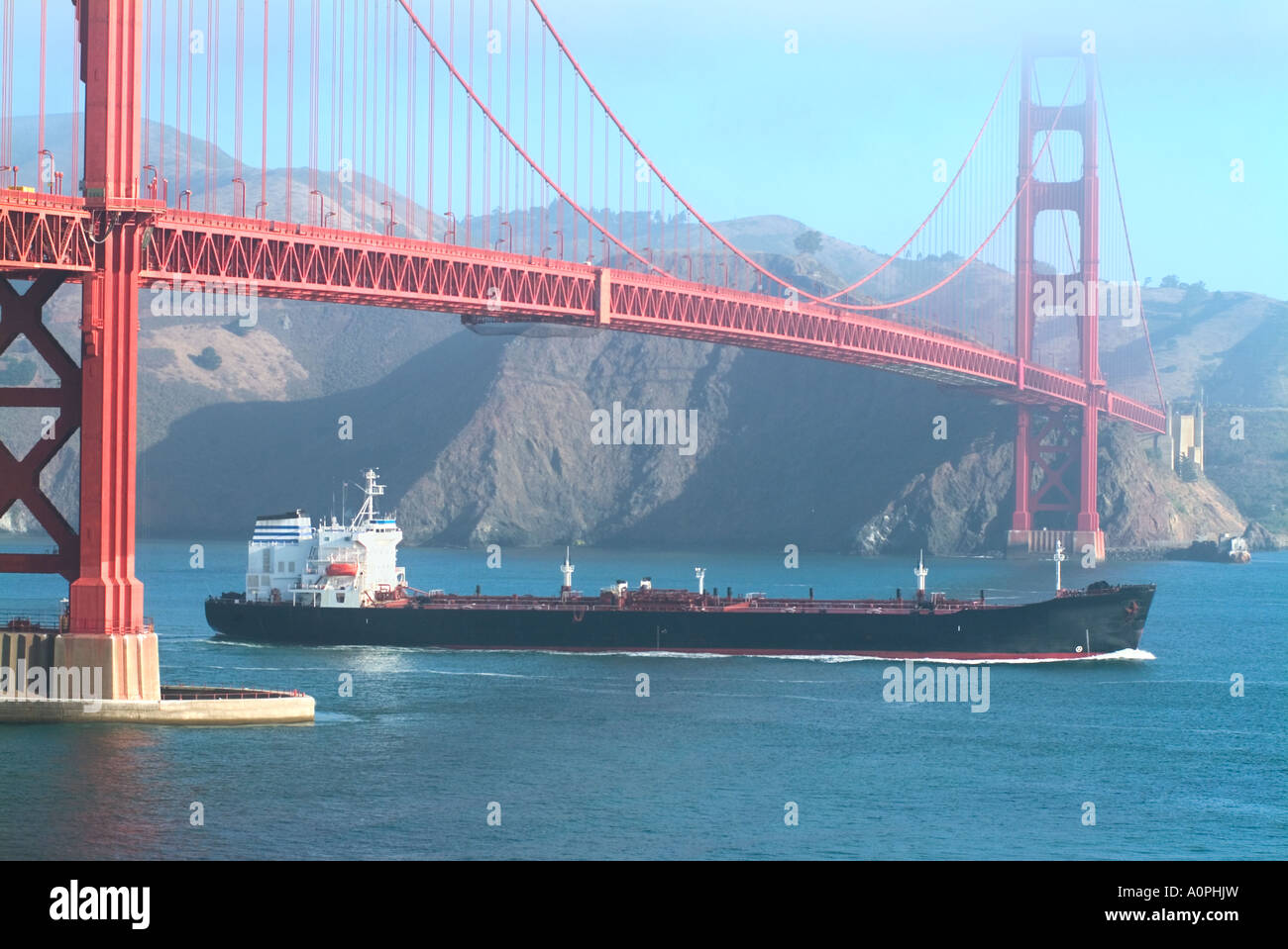 Oil tanker sailing underneath Golden Gate Bridge in San Francisco ...