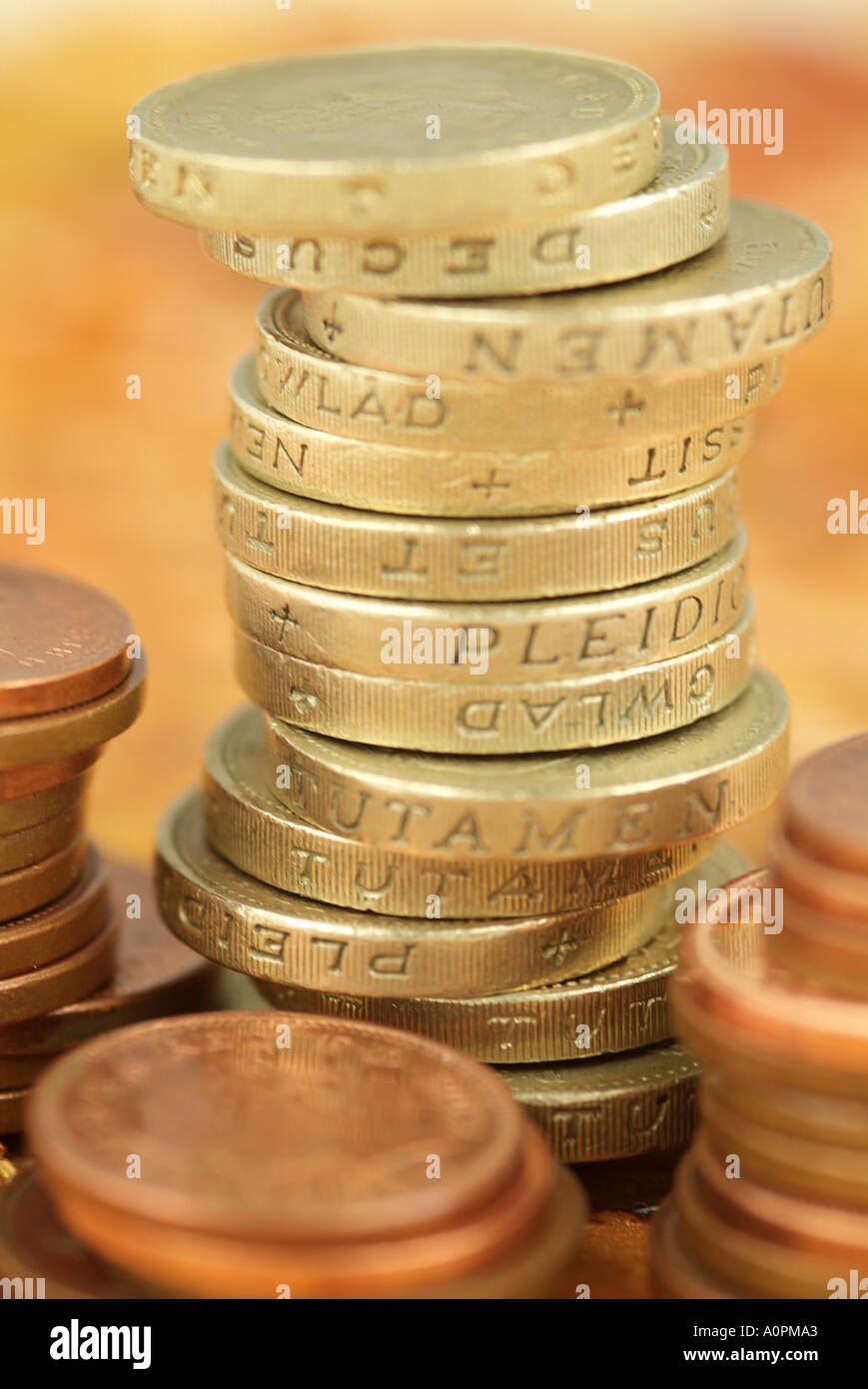 Close up, macro photograph of British money, pound coins, and bronze ...