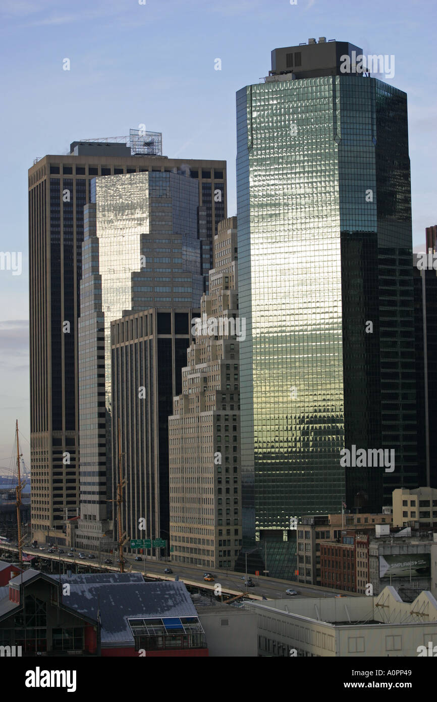 Modern reflective skyscraper buildings in early morning sunlight ...