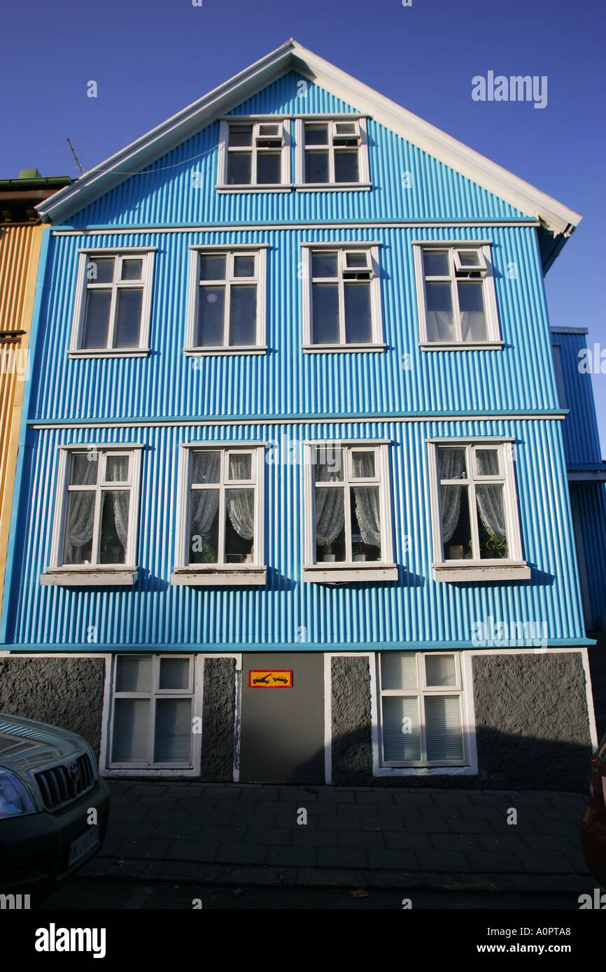 Typical bright blue painted corrugated clad town house in central ...