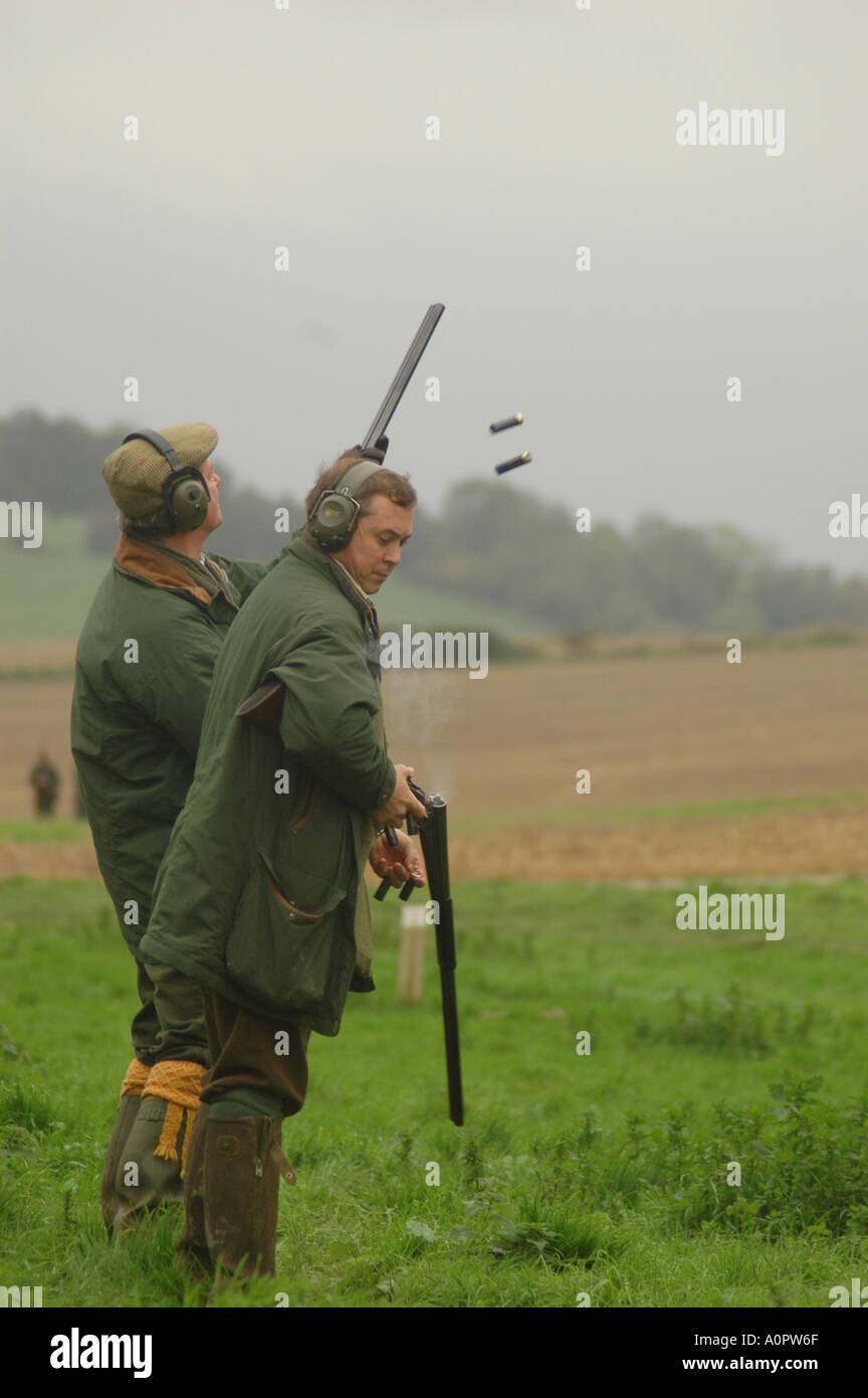Loader ejecting cartridges from gun Stock Photo - Alamy