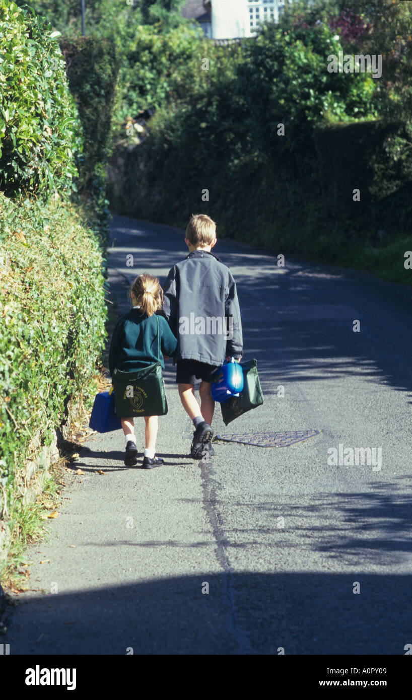 Two children walking to school Devon Stock Photo - Alamy