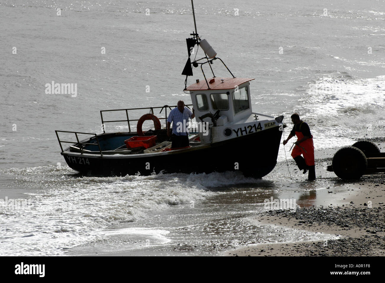 Fishing boat landed on beach hi-res stock photography and images - Alamy