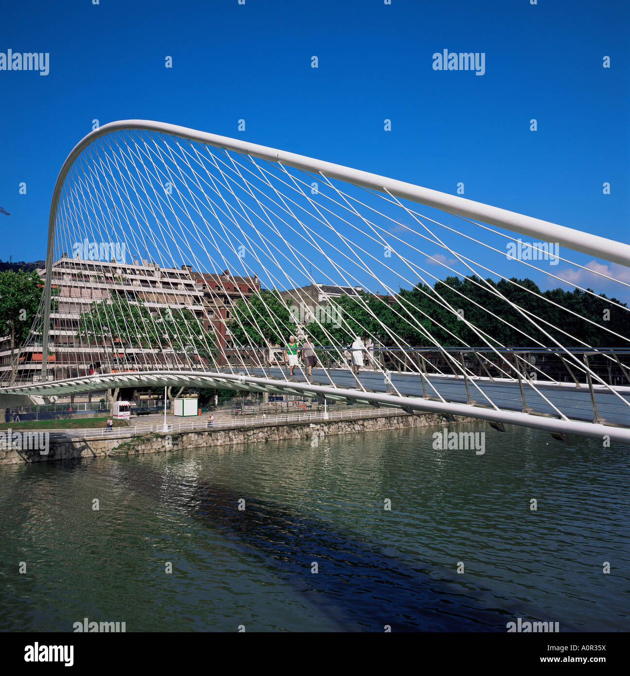Zubizuri curved pedestrian bridge across the Bilbao River Bilbao ...