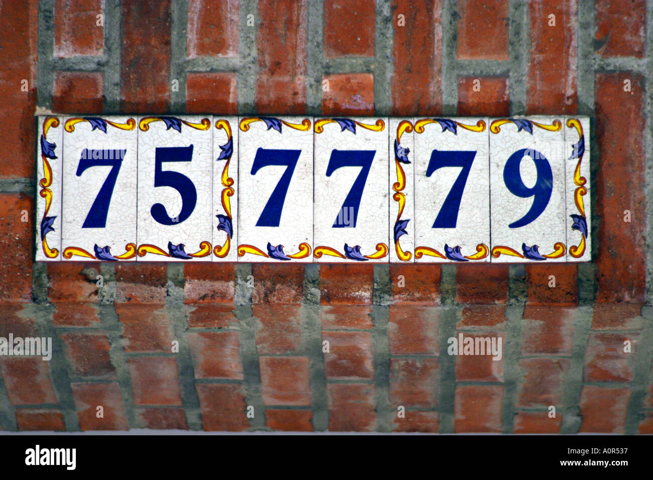 Numbers 75 77 and 79 on a building Stock Photo - Alamy