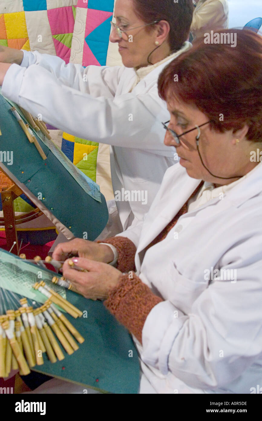Spanish artisan weaving lace with bobbins Stock Photo - Alamy