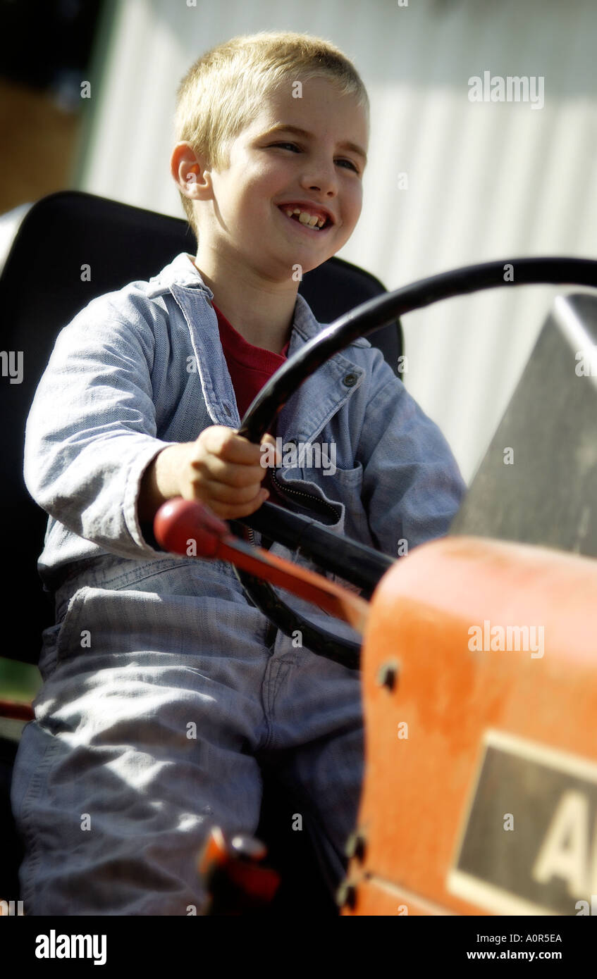 Farm boy driving tractor hi-res stock photography and images - Alamy