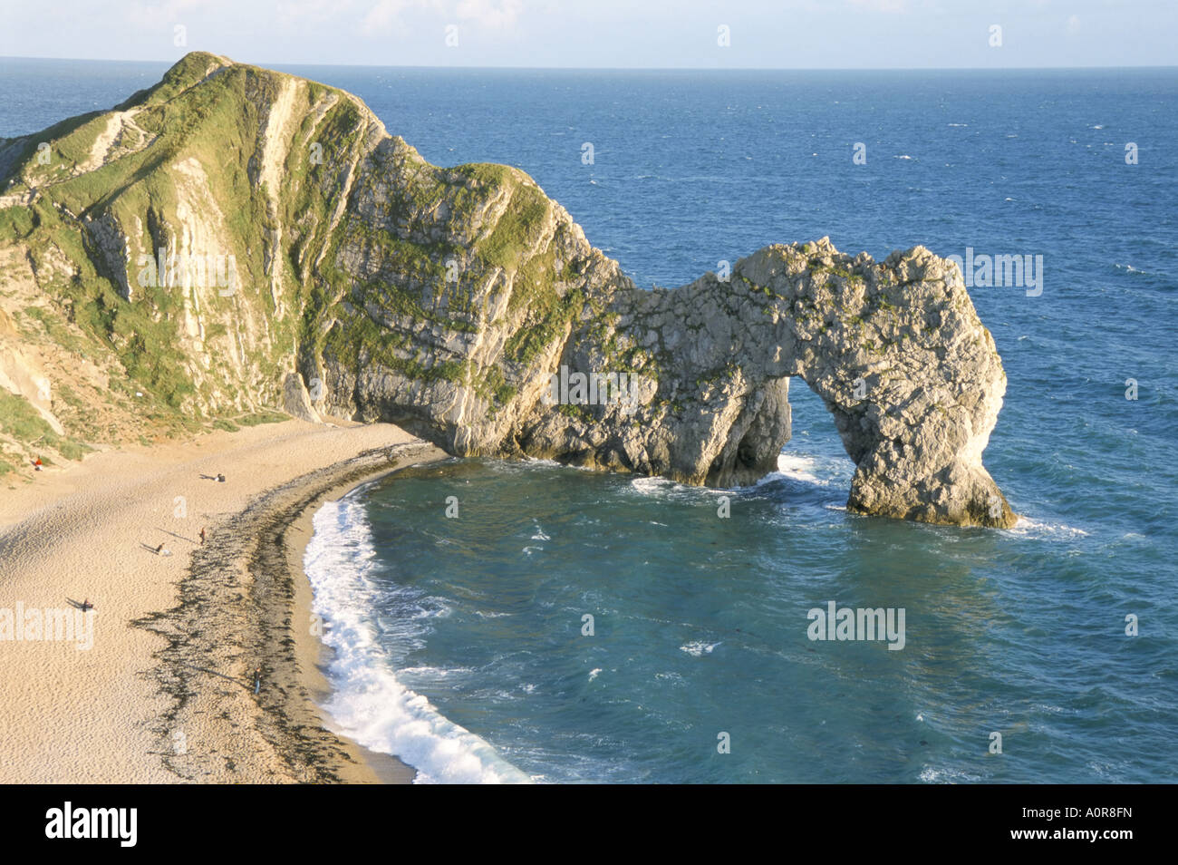 Wave cut arch in limestone headland Durdle Door Jurassic Heritage Coast ...