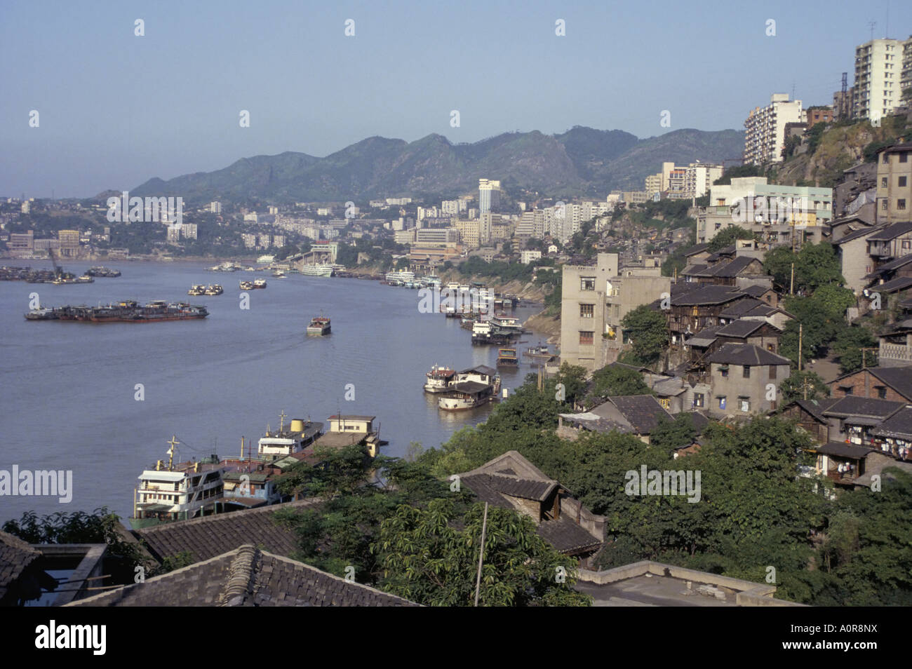 Town built on steep sandstone slopes above confluence of Yangtse and ...