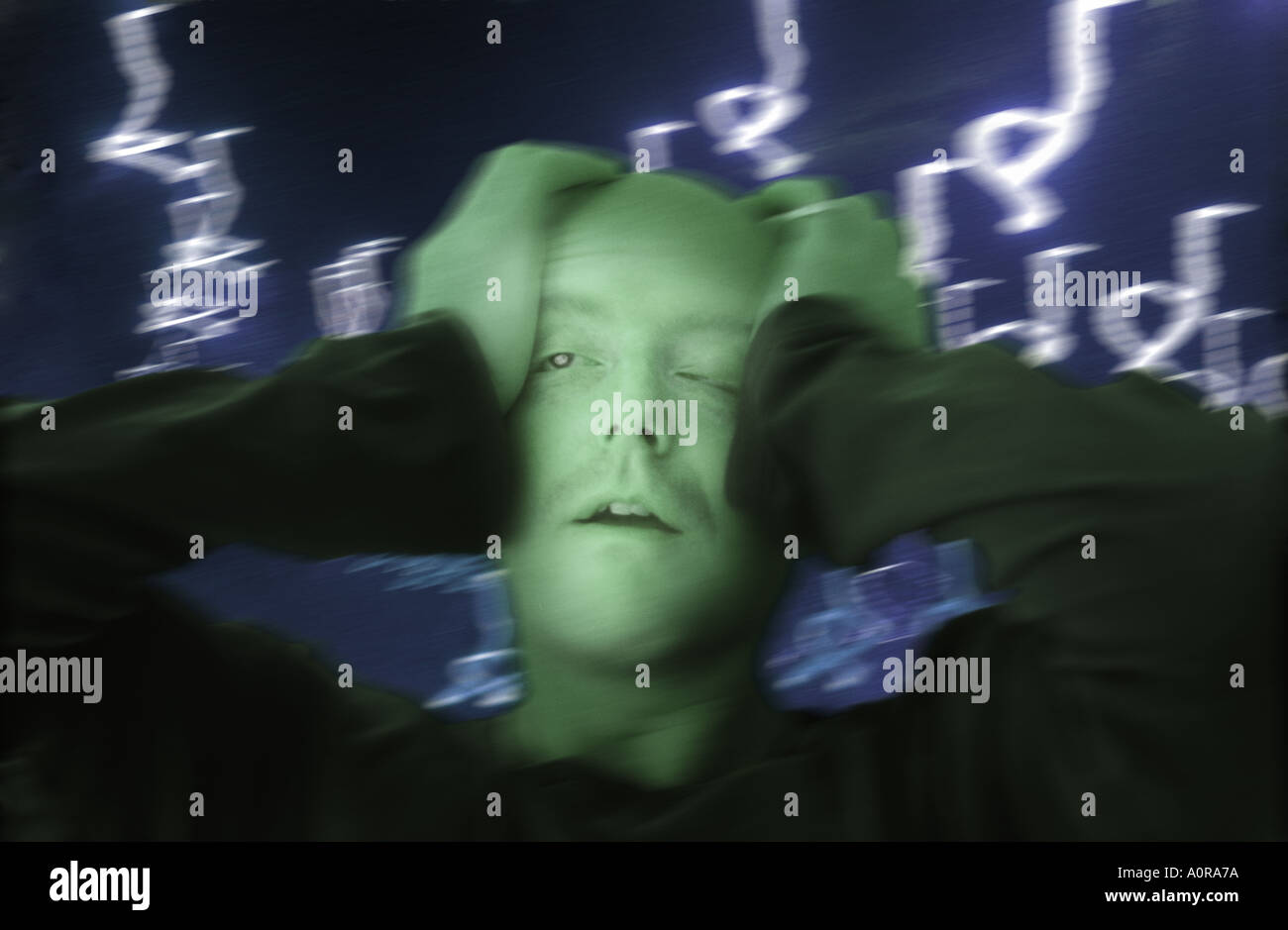 Male with anguished expression holding his head Stock Photo - Alamy