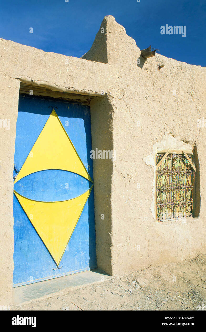 Mud house with colourful door village of Hassi Labiad on edge of Sahara ...