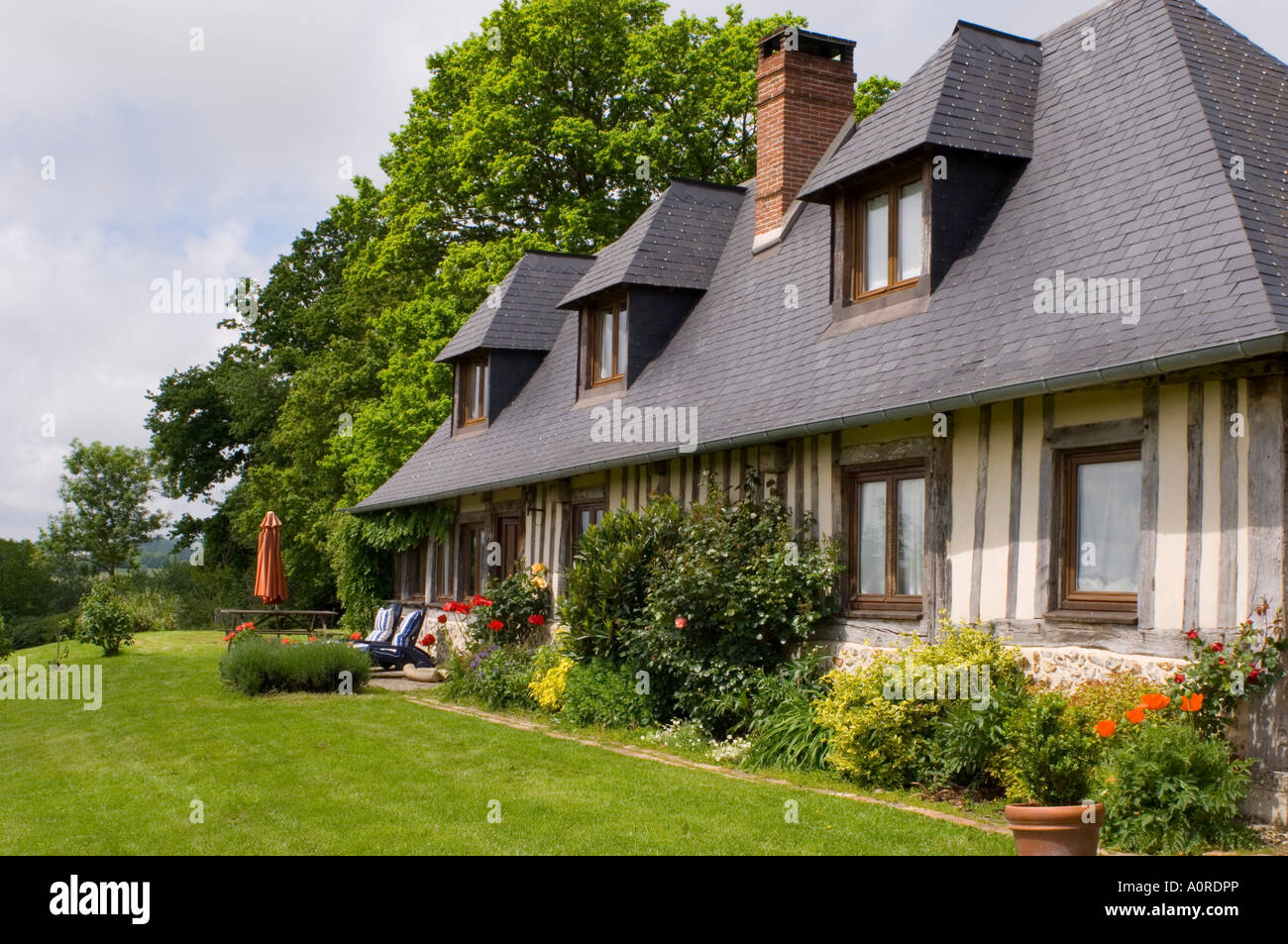An old half timbered barn converted into a house Normandy France Europe ...