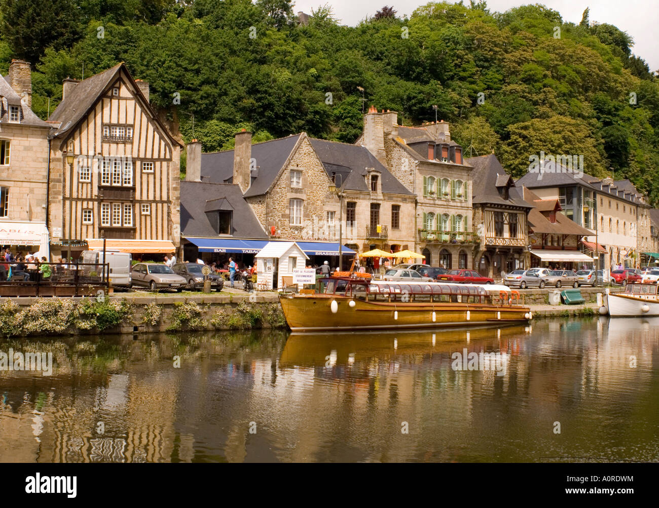Boats on the River Rance medieval buildings and waterfront cafes in ...