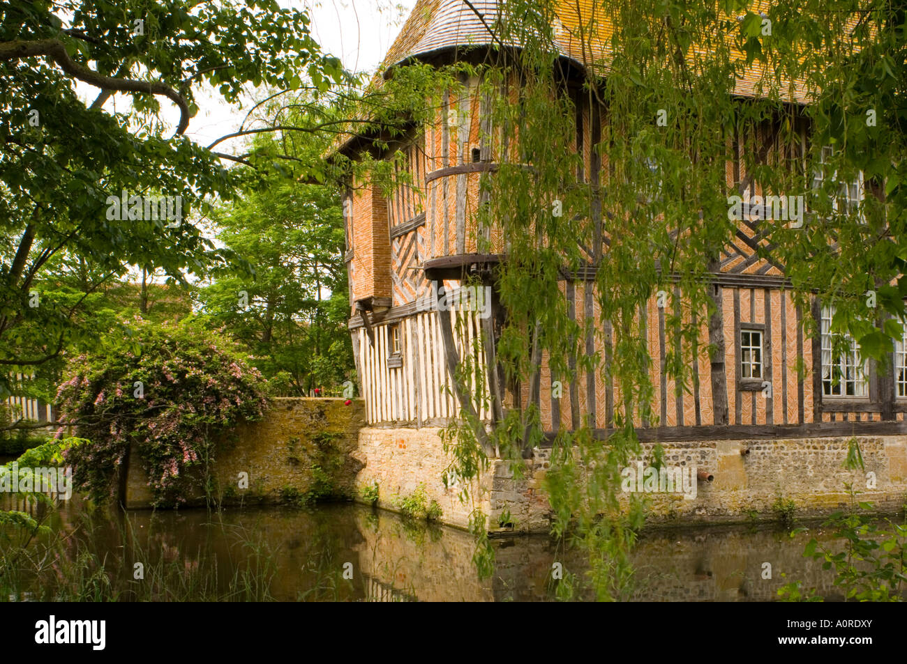 The half timbered manoire manor house and surrounding moat in ...