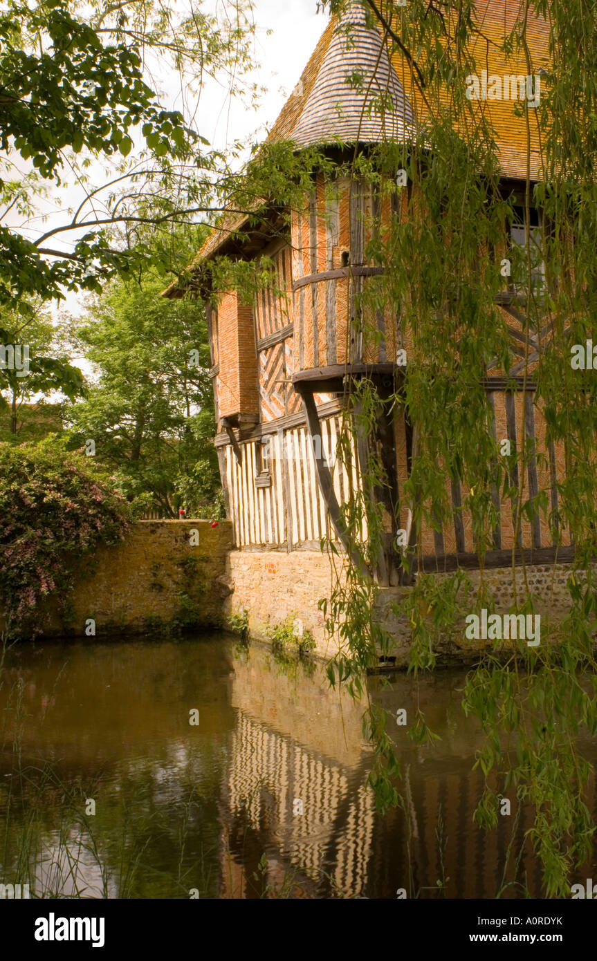 The half timbered manoire manor house and surrounding moat in ...