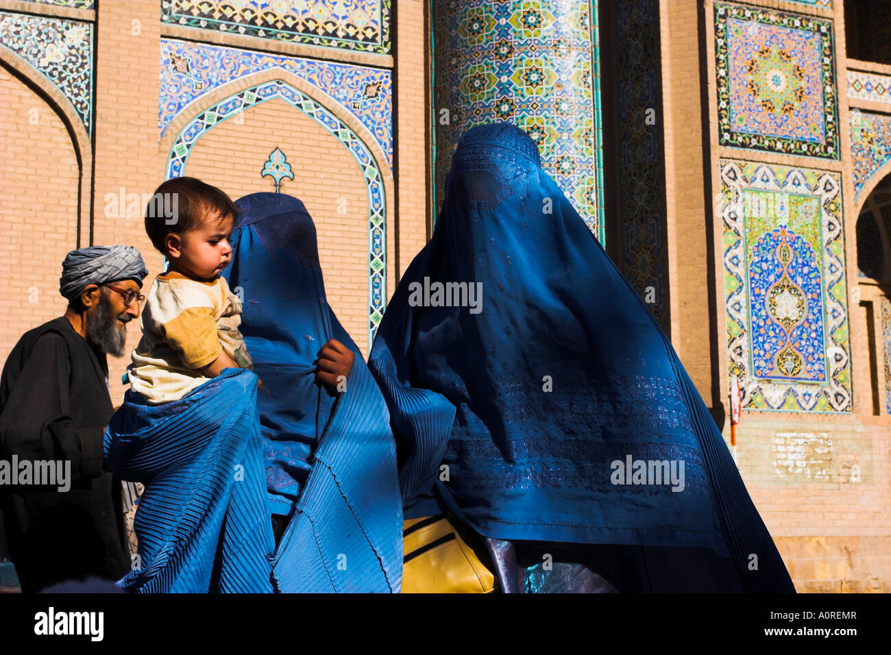 Ladies wearing blue burqas outside the Friday Mosque Masjet e Jam Herat ...