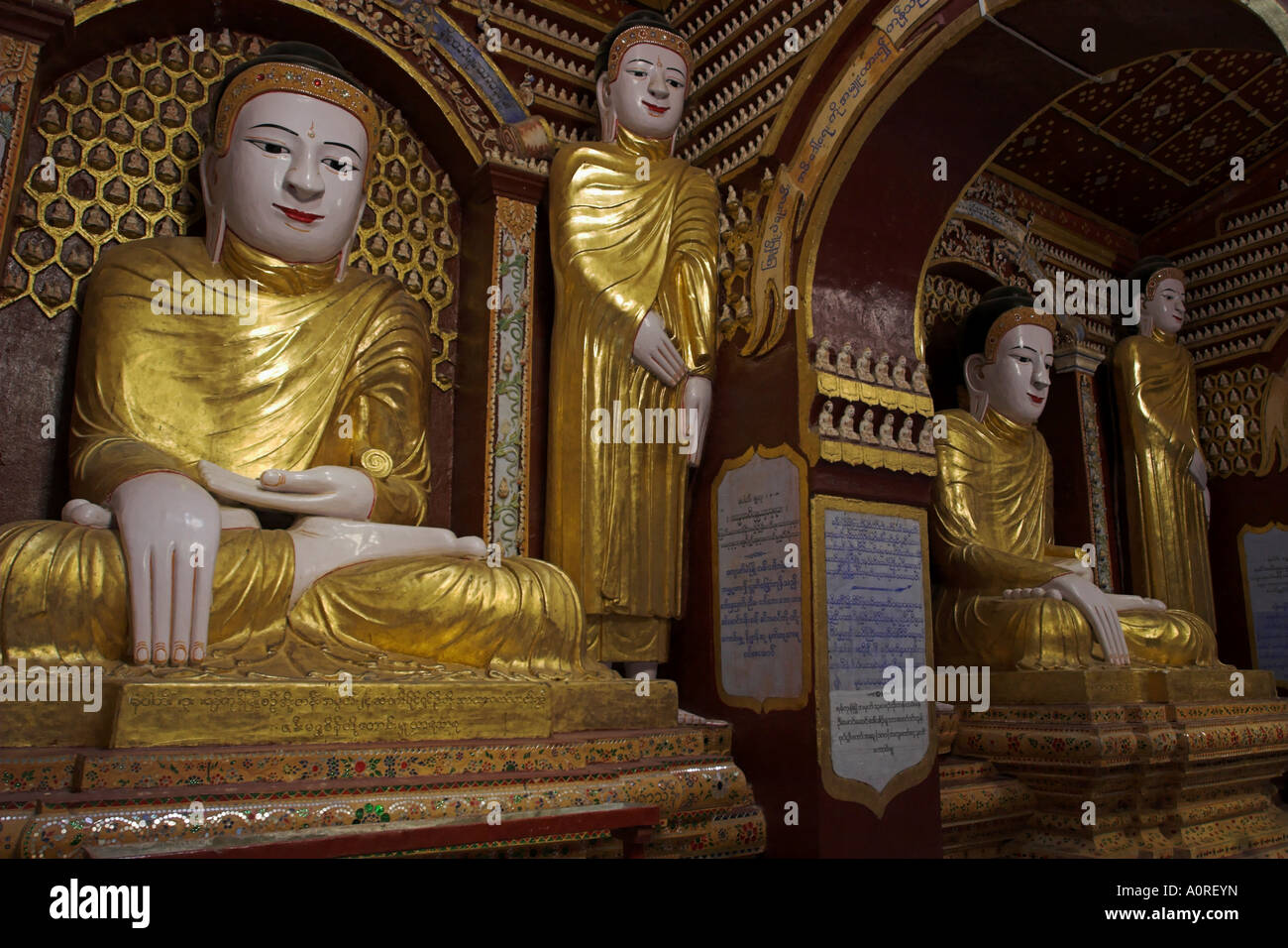 Golden Buddhas inside the paya Thanboddhay Paya built in the 20th ...