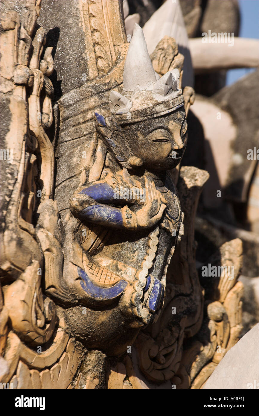 Figure carved in stucco decorates one of the ancient stupas Kakku ...