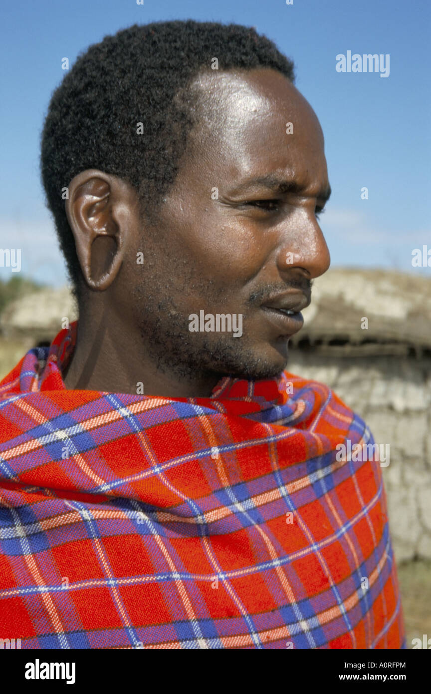 Portrait of a Masai in now traditional red checked cloth Masai Mara ...
