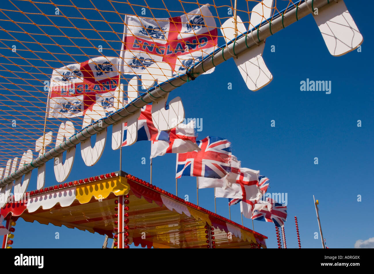 Funfair flags on beach Selsey Bill Sussex England United Kingdom Europe ...