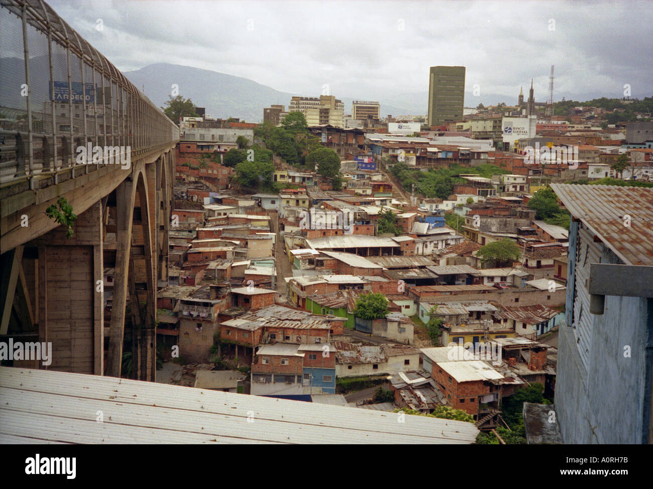 Panoramic view typical favela abodes built under bridge Bogotá Colombia ...