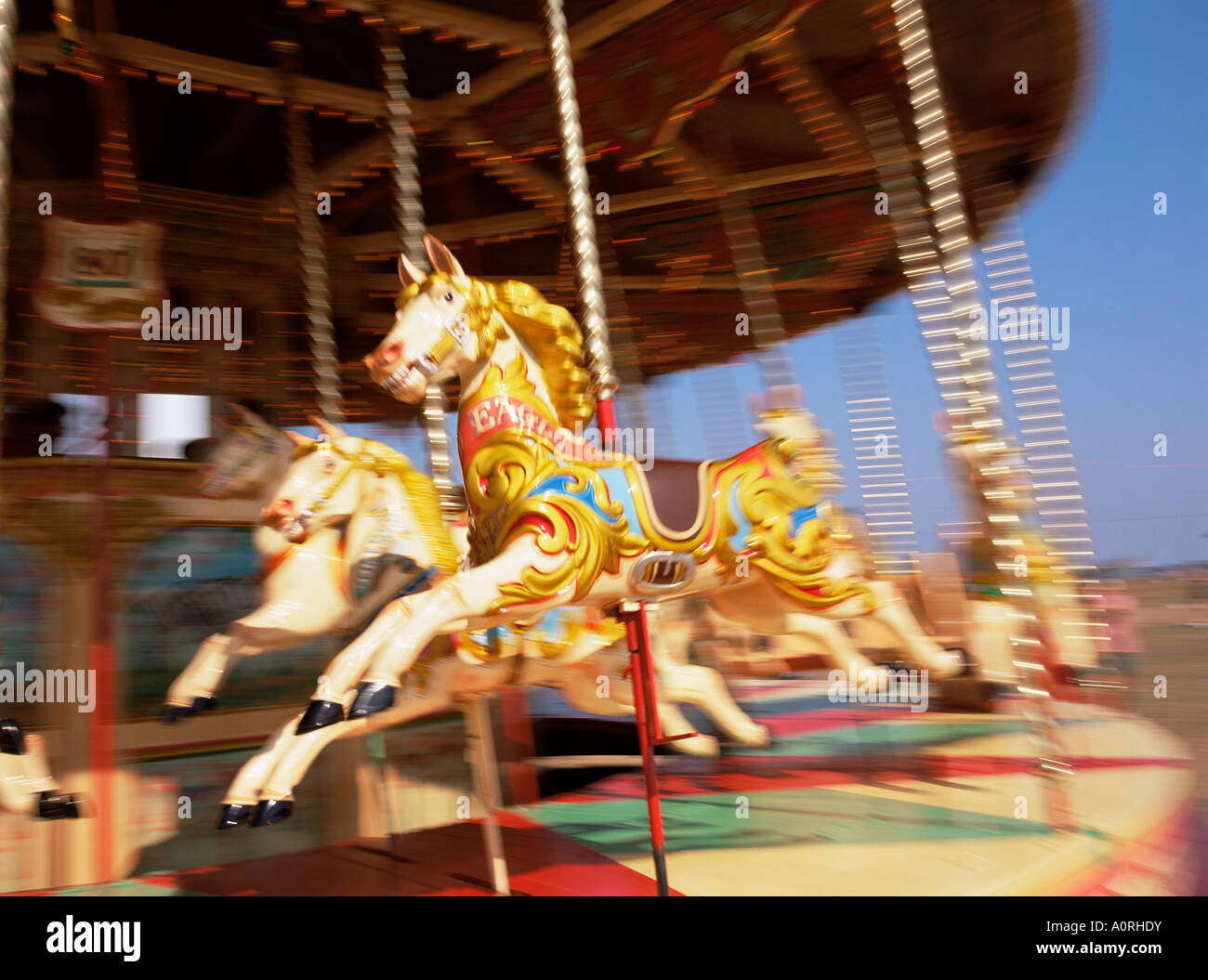 Roundabout at seaside fairground Devon England United Kingdom Europe ...